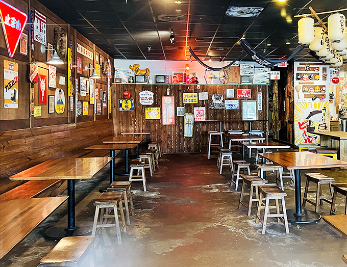 Wooden tables and metal stools create an authentic izakaya vibe, where strangers become friends over steaming bowls of goodness.