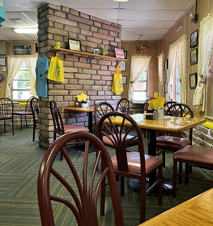 Brick dividers and wooden chairs create that "grandma's Florida living room" vibe where conversations flow as freely as the coffee.