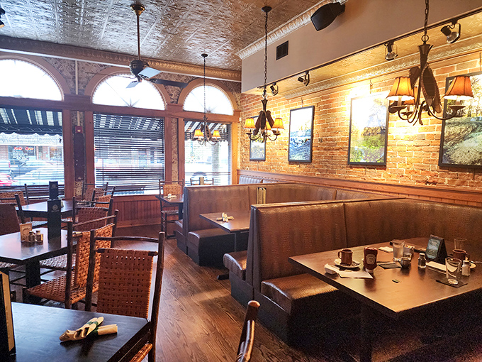 Warm wooden booths and exposed brick walls create an atmosphere that feels like coming home, even if it's your first visit.