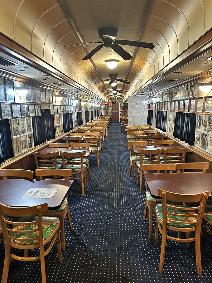 Step inside to discover a dining car where history and hunger meet, with wooden tables lined up like eager passengers.