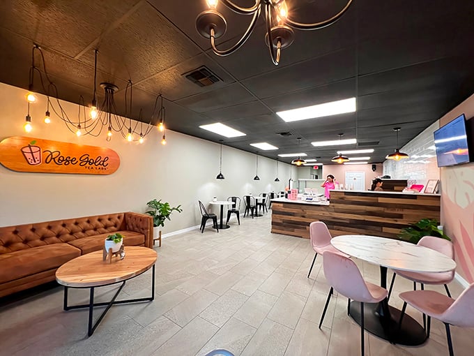 Pendant lights cast a warm glow over marble tables and that inviting leather sofa &ndash; the perfect backdrop for both serious conversations and frivolous selfies.