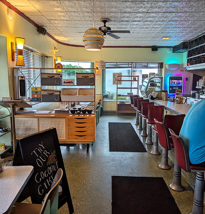 Red vinyl stools line the counter where locals perch for breakfast all day, watching short-order cooks perform their morning ballet.