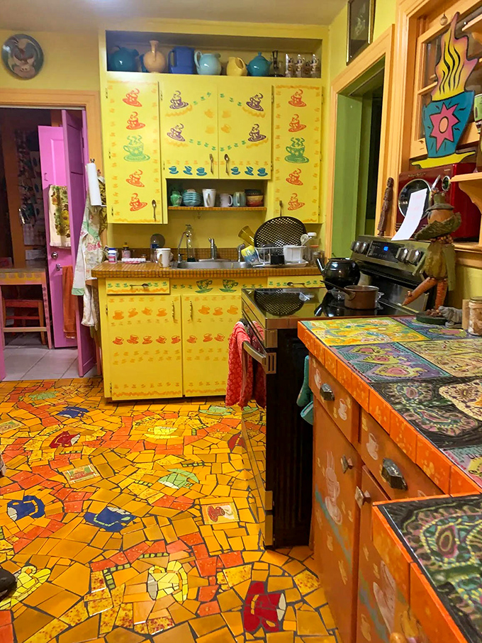 This kitchen proves that cooking can be an art form even before you start chopping vegetables &ndash; those yellow cabinets are serving serious sunshine vibes.