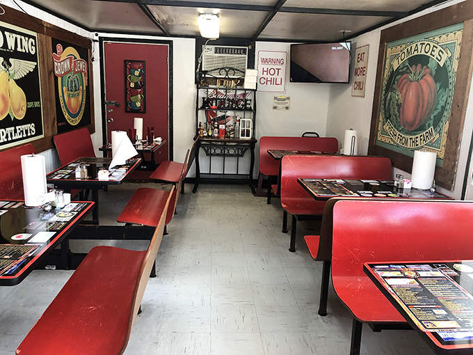 Simple red booths and vintage decor create the perfect backdrop for serious burger business.