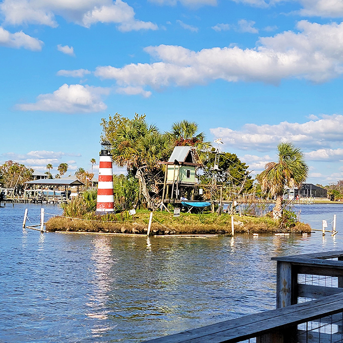 The red and white lighthouse stands sentinel on Monkey Island, though the monkey residents haven't quite mastered maritime navigation... yet.