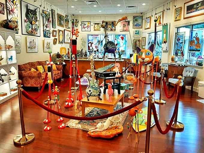 Inside, art doesn't just hang on walls—it throws a party. Red velvet ropes guide visitors through rooms where every inch competes for attention like puppies at an adoption event.