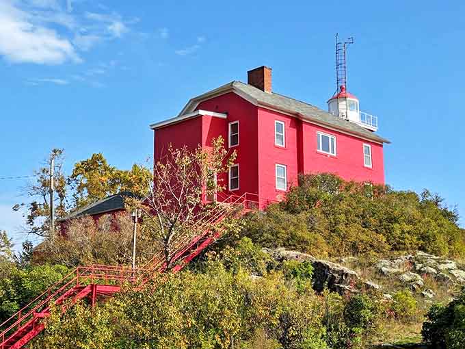 The vibrant red Marquette Harbor Lighthouse stands like a cherry on top of Lake Superior's rocky shoreline &ndash; a beacon of history since 1866.