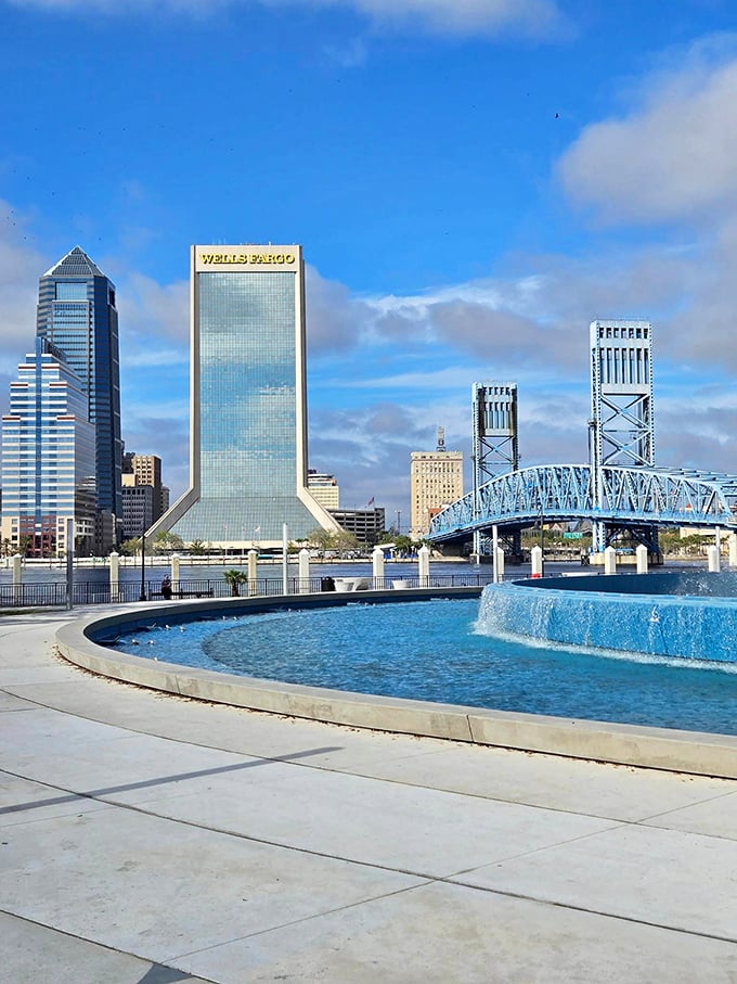 Morning light bathes the fountain and downtown Jacksonville in golden hues, creating a tranquil start to the day for early risers.
