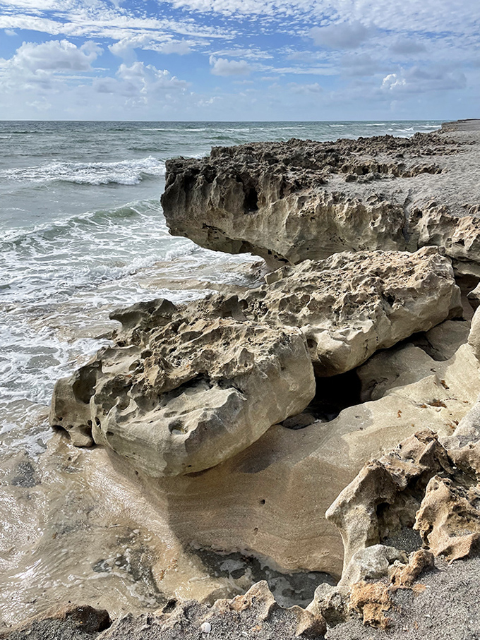 Where earth meets ocean in rugged harmony &ndash; these weathered limestone formations have been sculpted by waves for millennia.