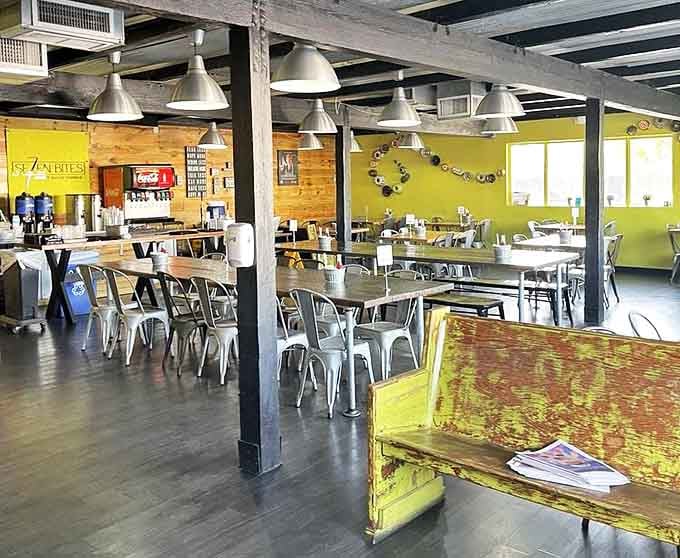 Industrial meets homey in this bright space where wooden beams and metal chairs create the perfect backdrop for comfort food magic.
