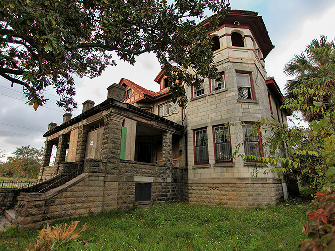 Time and elements conspire against stone and wood, yet the mansion's profile remains proudly defiant against Florida's relentless sky.