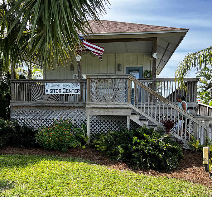 The St. George Island Visitor Center welcomes explorers with its charming coastal architecture, nestled among swaying palms and native vegetation.