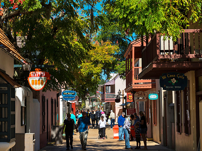 St. George Street buzzes with life as visitors wander between colonial-era buildings now housing quirky shops and inviting caf&eacute;s.