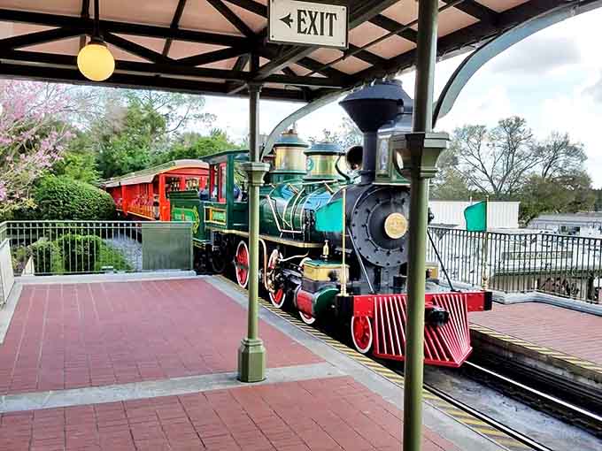 Passengers eagerly await their journey at the meticulously designed station, where Victorian architecture meets Disney's legendary attention to detail.