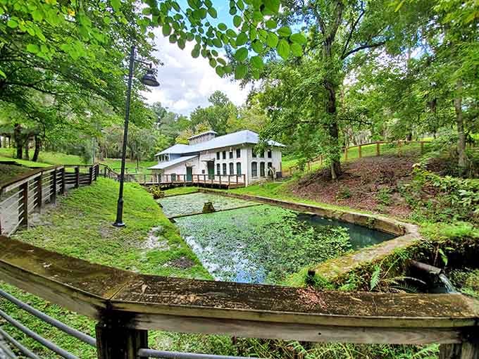 This white Victorian-era waterworks building stands like a ghost from Florida's industrial past, its reflection dancing in emerald pools.