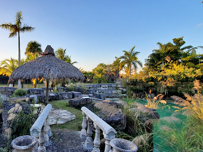 The wide-angle view reveals the lagoon's stunning layout, with thatched huts and lush vegetation creating a postcard-perfect tropical paradise.