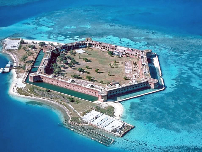 From above, the hexagonal fortress commands Garden Key, its strategic design a testament to military engineering genius.