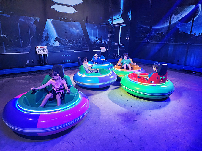 Neon-lit bumper cars await their next drivers, where family feuds are settled with gentle collisions and uncontrollable giggles.