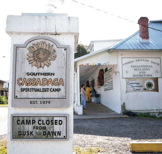 The Southern Cassadaga Spiritualist Camp entrance marker stands proudly since 1874, with a gentle reminder that spirits need their beauty sleep between dusk and dawn.