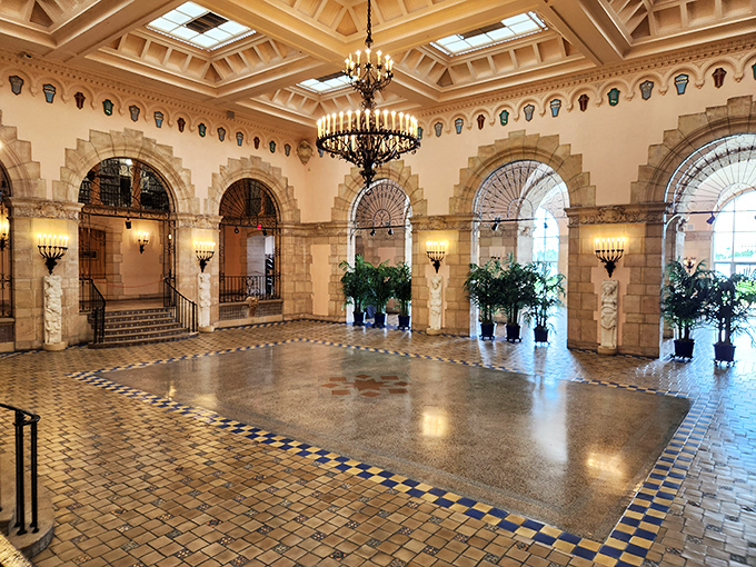 The entrance hall welcomes visitors with marble elegance that whispers, "Your living room will never compare to this."