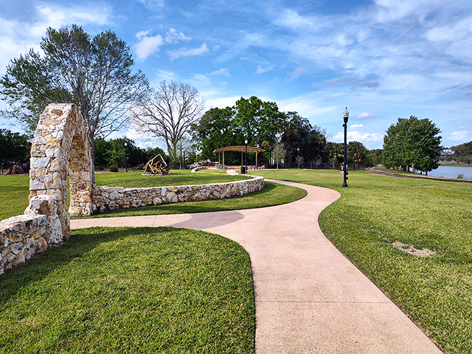 Winding pathways lead visitors through lush greenery, creating a natural gallery where each turn reveals a new artistic surprise.