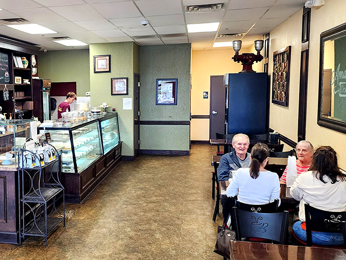 The cozy interior invites lingering conversations over coffee and cake, where regulars and newcomers alike find common ground in sugar.