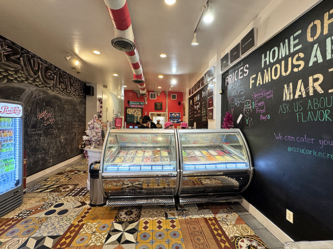 Inside Azucar, the colorful interior feels like stepping into a dessert wonderland, where chalkboard menus and candy-striped pipes create a playful atmosphere.