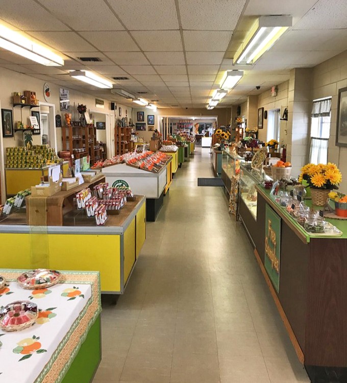 Stepping inside reveals a nostalgic wonderland where vibrant yellow counters showcase Florida's sweetest treasures.