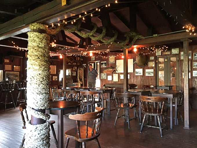 String lights dance across wooden beams while tree trunks serve as nature's pillars &ndash; dining room or enchanted maritime forest? At Cap's, it's deliciously both.