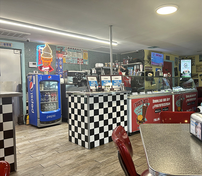 Step inside and the checkered floors transport you straight to the Eisenhower era, minus the Cold War anxiety and plus unlimited ice cream options.