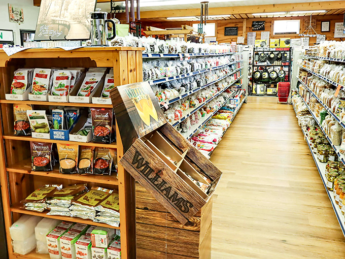 Wooden shelves lined with colorful packages create narrow pathways of temptation, each aisle a new adventure in culinary discovery.