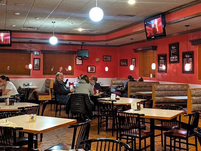 Warm red walls and cozy booths create the perfect backdrop for Beatles memorabilia, inviting diners to settle in for a meal that hits all the right notes.