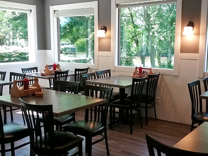 Sunlight streams through large windows, illuminating a dining room where countless conversations and comfort meals have unfolded over the years.