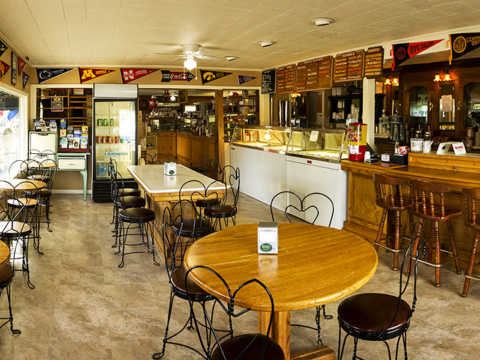 Heart-shaped wire chairs and wooden tables create a nostalgic atmosphere where time slows down for chocolate appreciation.