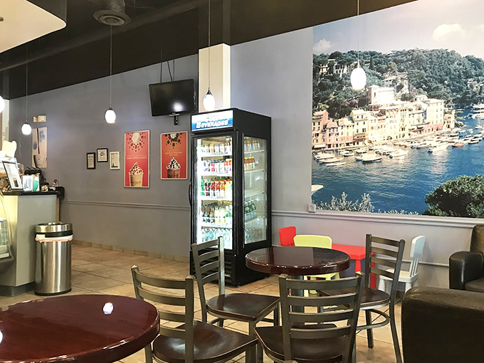 Inside, the café's cozy interior features a stunning coastal Italian scene that transports you thousands of miles away while your gelato stays perfectly chilled.