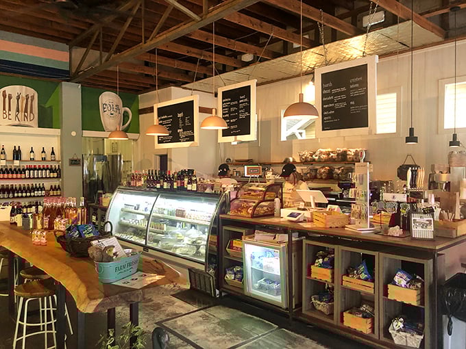 Inside, rustic meets modern with exposed beams, pendant lighting, and a counter that showcases both pastries and possibilities.