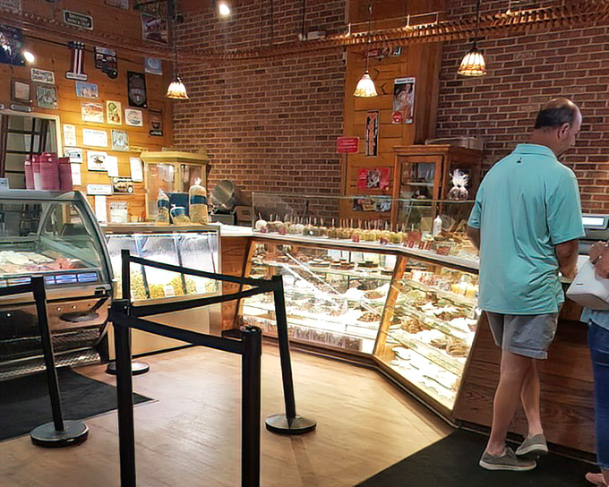 Inside, brick walls and glass display cases create the perfect backdrop for sweet treasures that await eager candy enthusiasts.