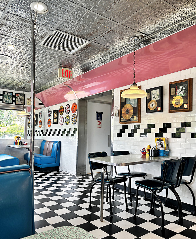 Checkerboard floors meet turquoise booths in this perfectly preserved slice of Americana, where every corner tells a story of simpler times.