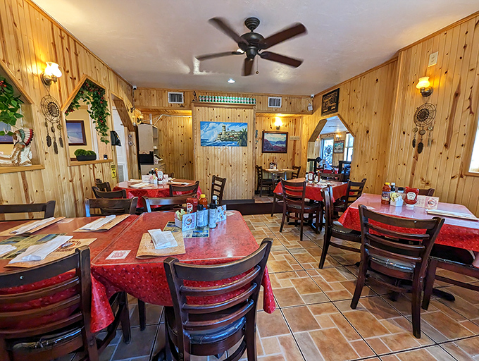 Warm wood paneling and red-checkered tablecloths create that "grandma's dining room" feeling where you know something delicious is coming your way.