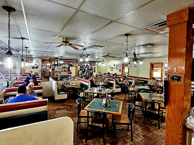 Step inside to discover a classic diner atmosphere where ceiling fans lazily spin above comfortable booths and the promise of enormous portions.