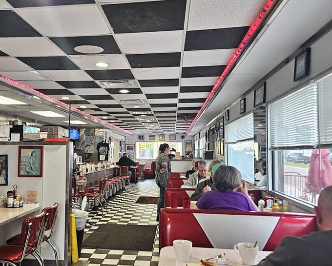 Step inside and the checkerboard floor leads you through a time portal where red vinyl booths invite lingering conversations over endless coffee refills.