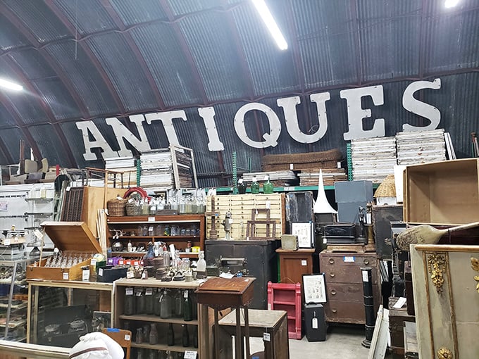 Step inside and be greeted by a cathedral of curiosities, where "ANTIQUES" isn't just a sign but a promise of adventures to come.