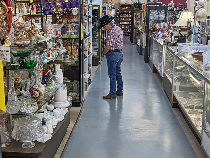 Step inside and the modern world melts away as this gentleman browses treasures from decades past, each aisle a new chapter in American history.