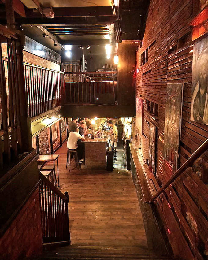 Multiple levels of vintage charm create an intimate maze where every corner reveals another reason to stay just one more hour.