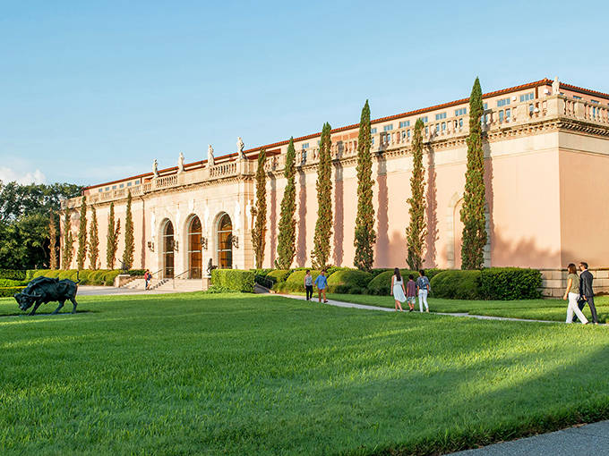 Tall columns and pink walls make this museum look like a palace from a faraway land.