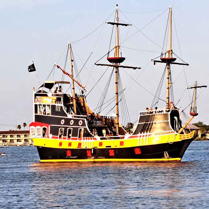 This colorful vessel looks like someone painted a rainbow onto a pirate ship and somehow made it work perfectly.
