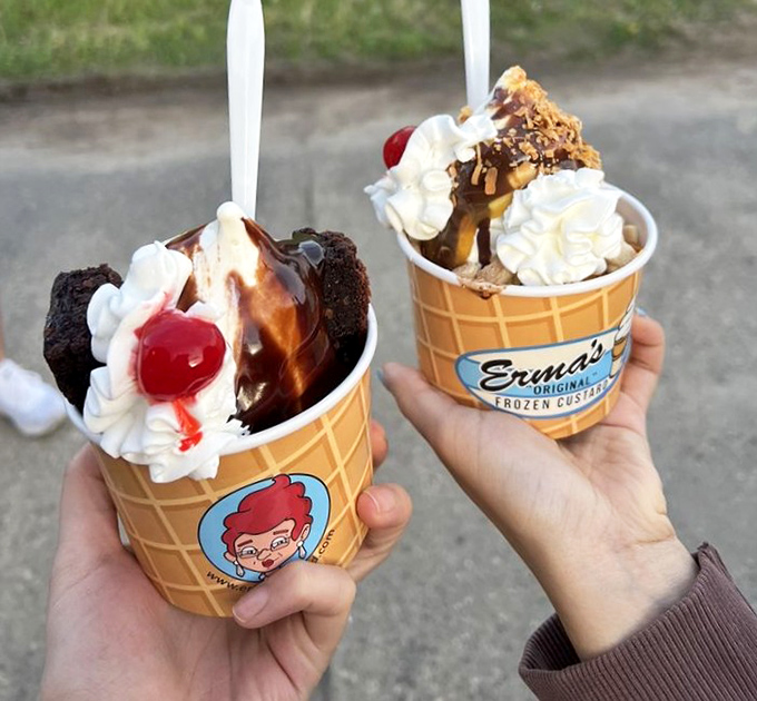 Erma's hot fudge brownie sundae and caramel pecan delight – where frozen custard meets warm toppings in a dance of temperatures that'll make your taste buds tango.