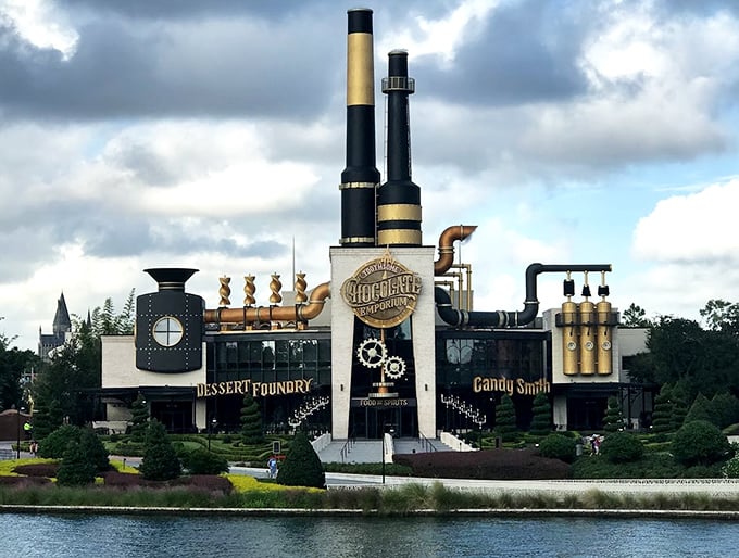 The Toothsome Chocolate Emporium rises like a steampunk fantasy, complete with towering smokestacks and industrial-Victorian charm.