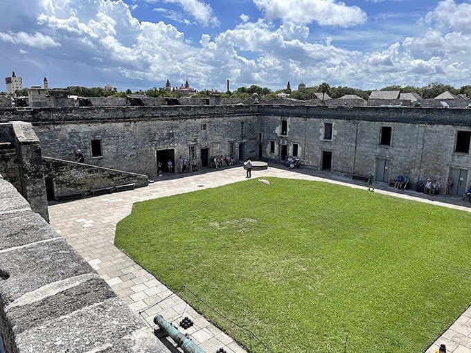 The fort's expansive interior courtyard reveals its impressive scale, with grassy parade grounds where centuries of soldiers once marched in formation.