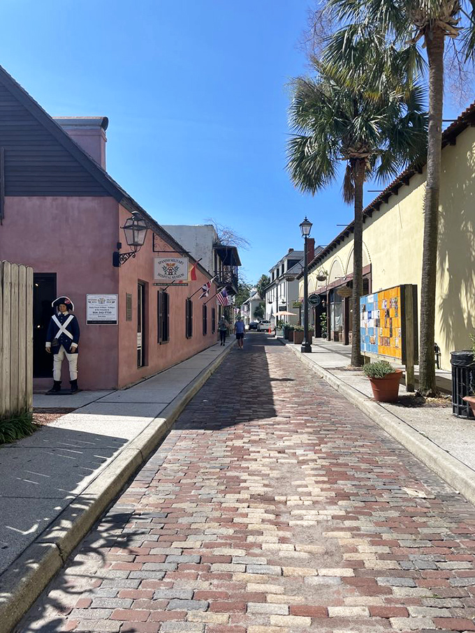 That soldier isn't texting anyone—he's guarding centuries of history on this picturesque colonial lane.